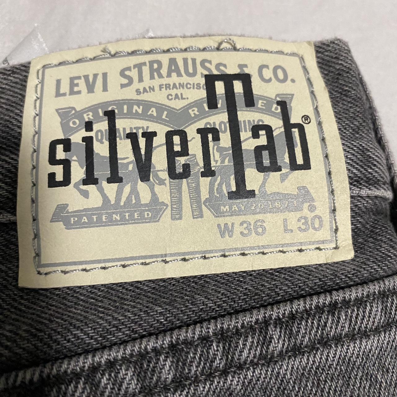 Black Levi’s loose sliver tab jeans -cut at the bottom | Depop