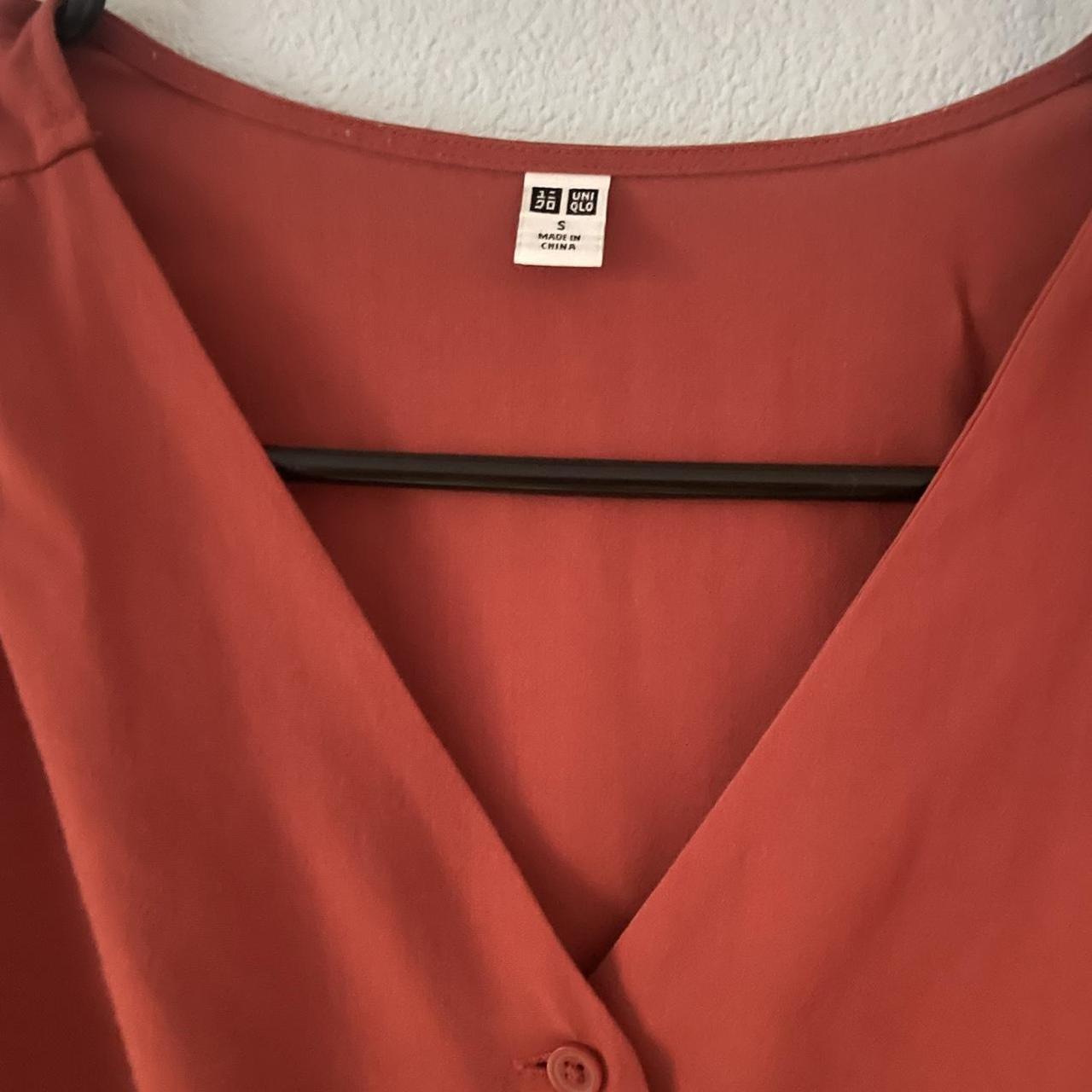 Orange UNIQLO blouse with puffy sleeves. Fits a size... - Depop