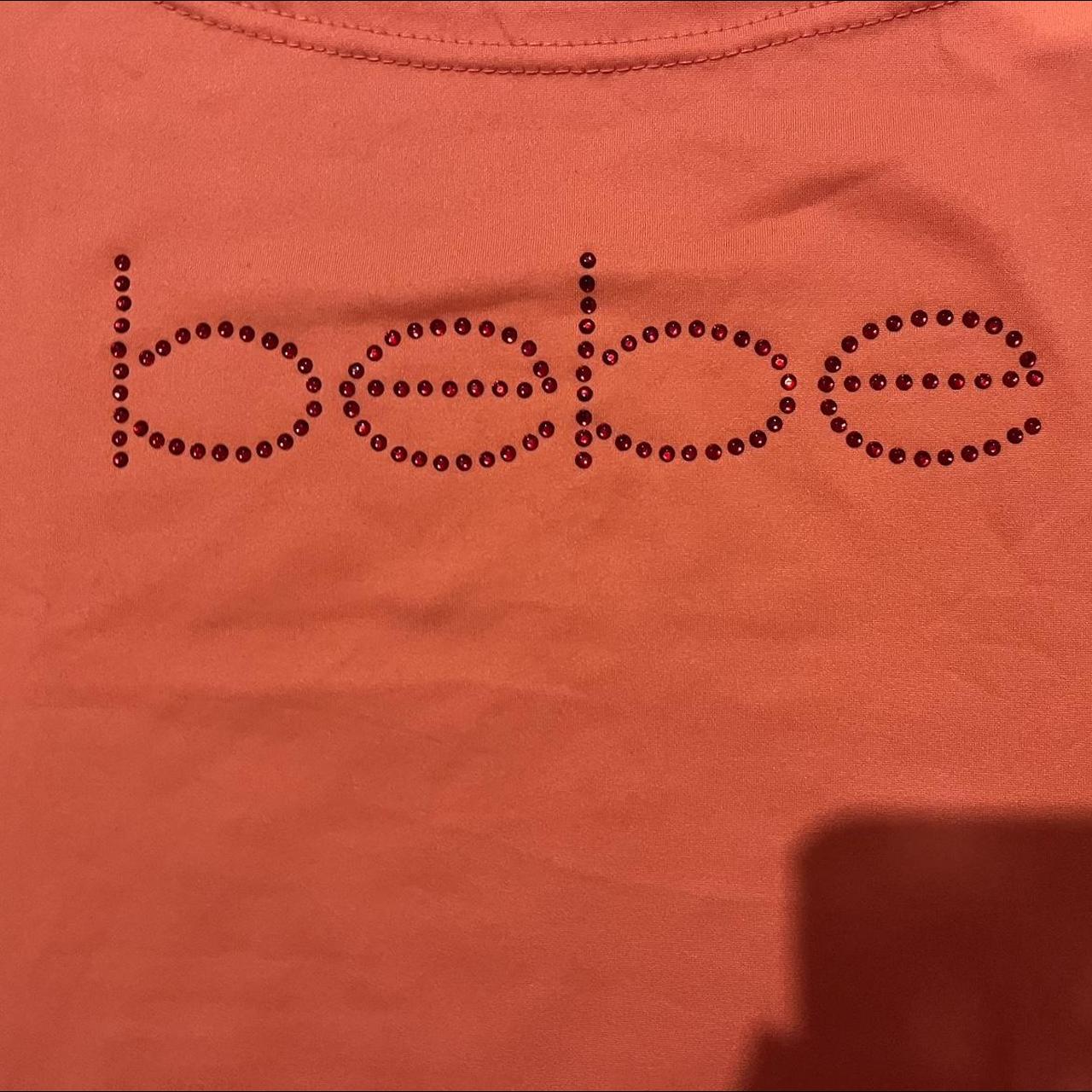 coral bebe rhinestone top can be worn on or off... - Depop