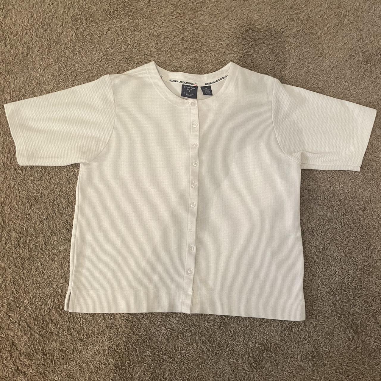 white shirt missing a button and has two small... - Depop