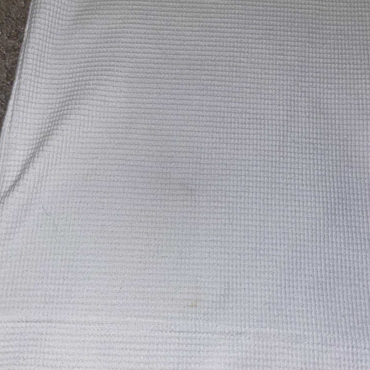 white shirt missing a button and has two small... - Depop