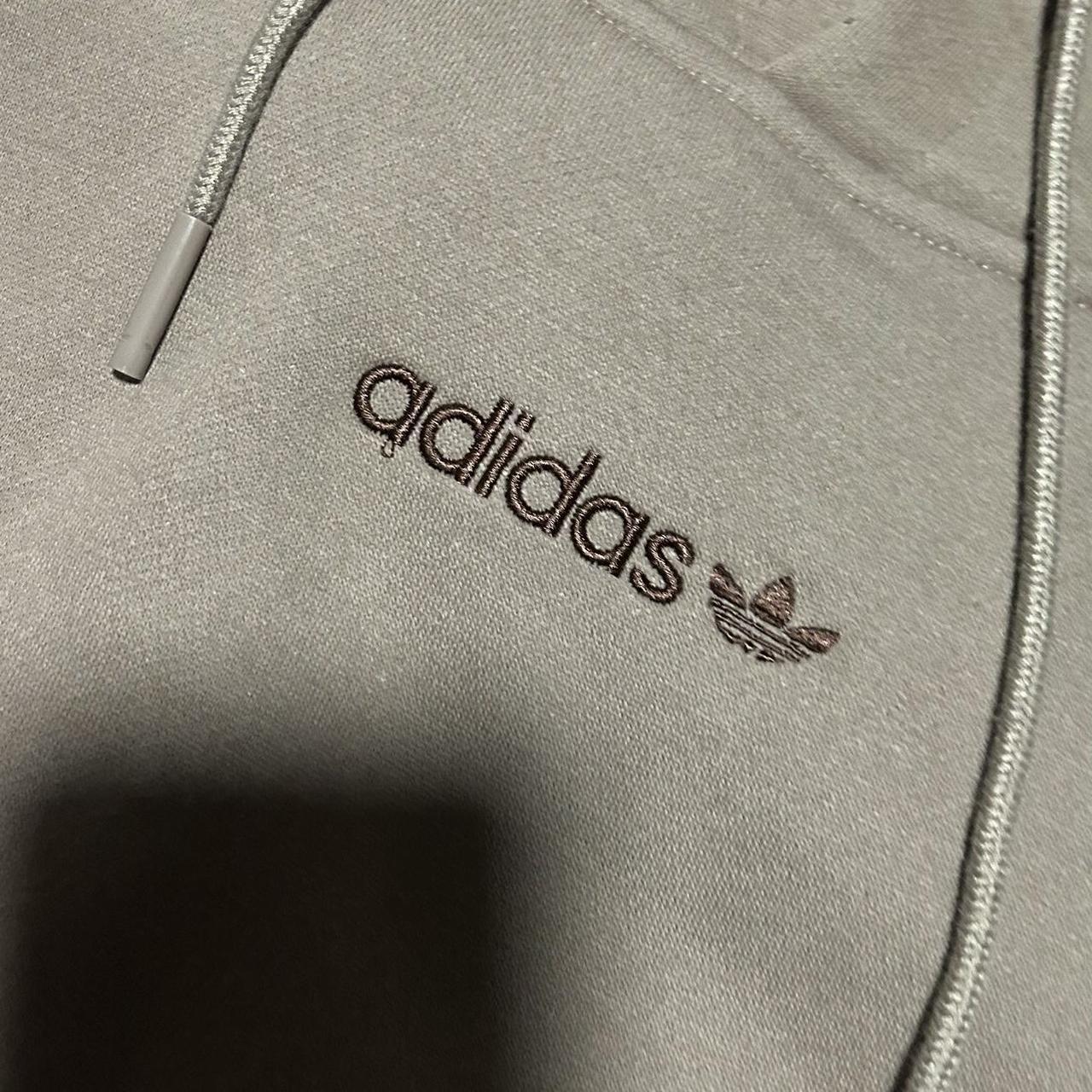 brown adidas hoodie with sleeve patch and... - Depop