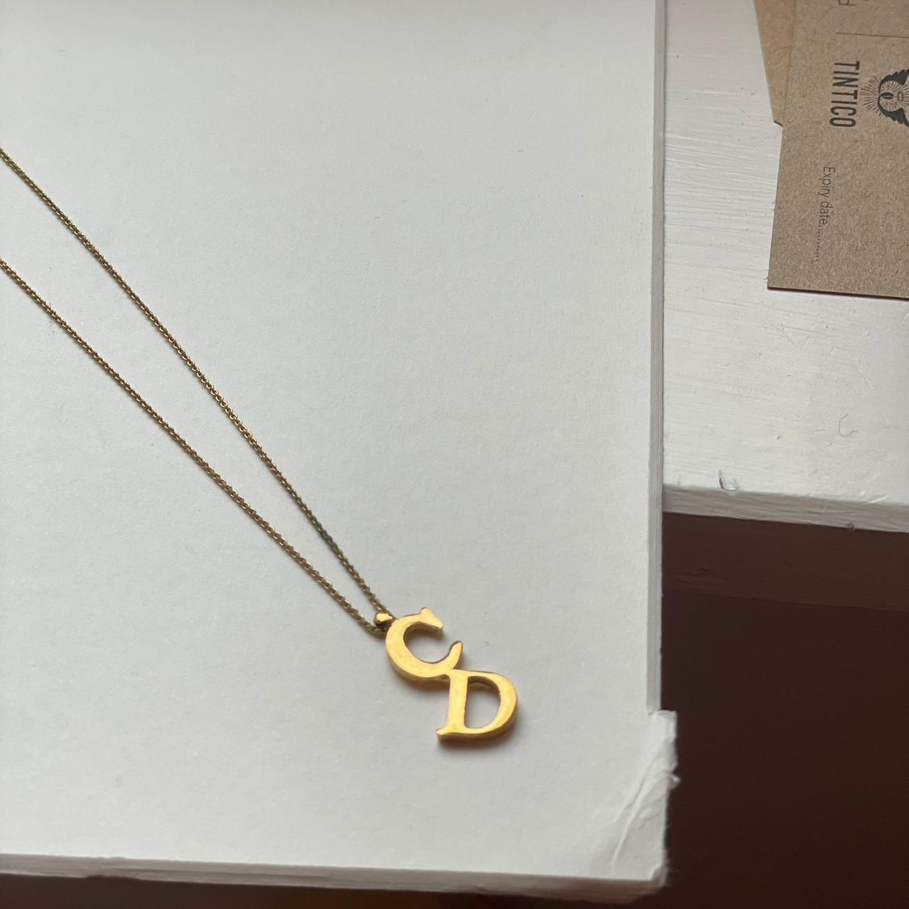 Authentic Christian Dior gold toned necklace with CD... - Depop