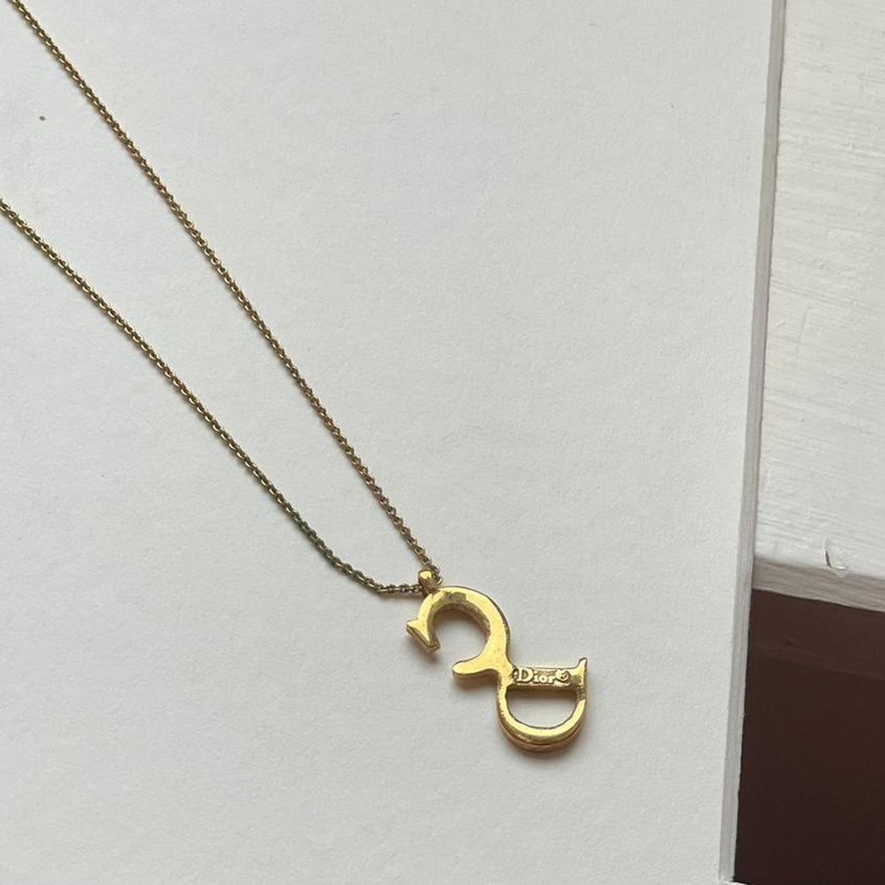 Authentic Christian Dior gold toned necklace with CD... - Depop