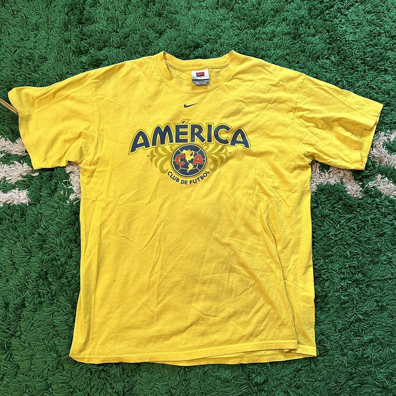 America football center swoosh yellow tee size... - Depop