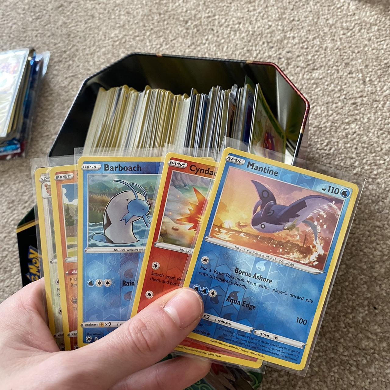 300 Pokémon & tin bundle At least 100 holo/reverse... - Depop