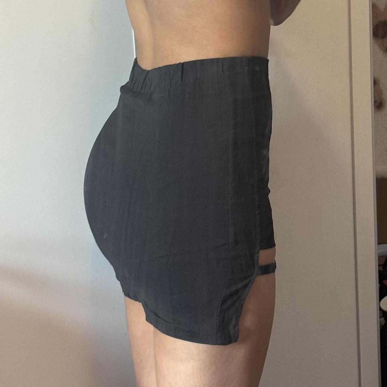 black mini skirt with a slit on the side and a ring... - Depop