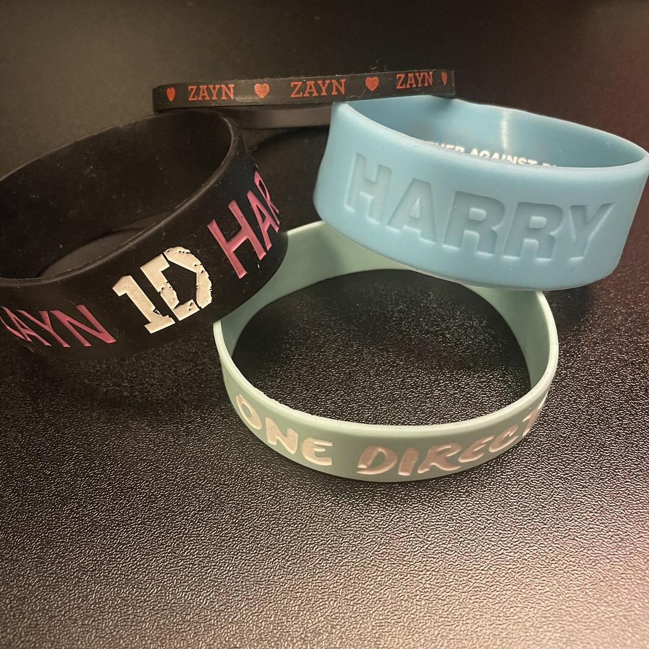 4 pack one direction rubber bracelets •3 thick ones... - Depop