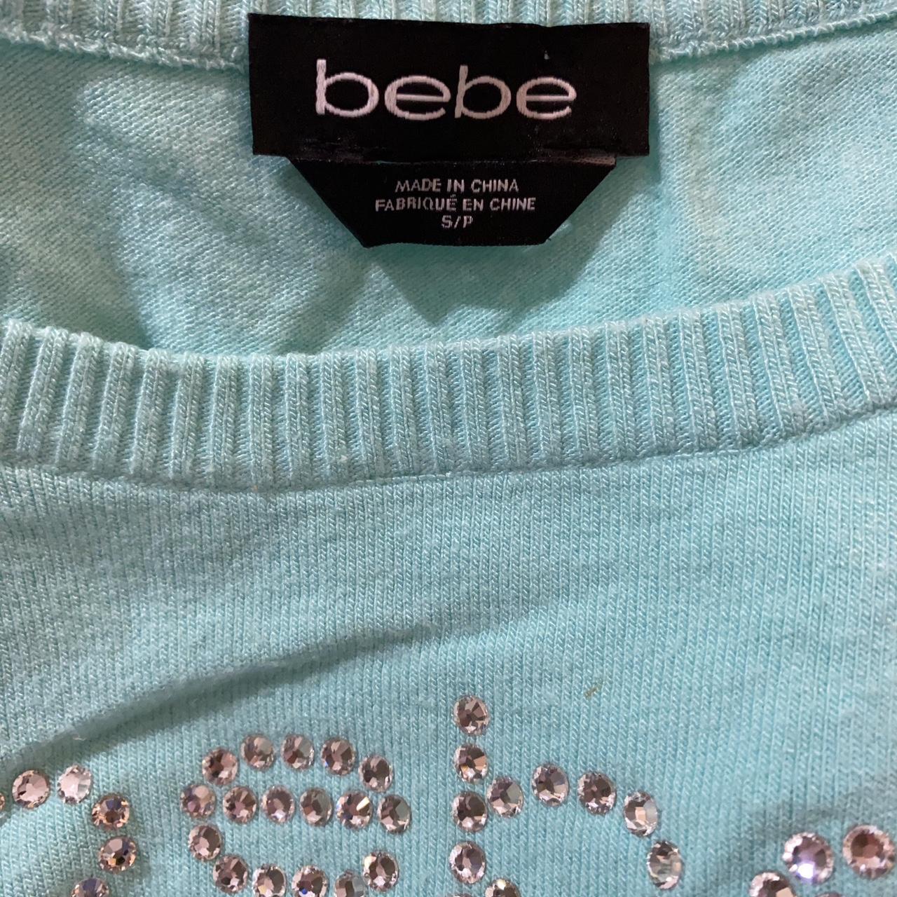 Bebe small short sleeve baby blue top with bedazzled... - Depop
