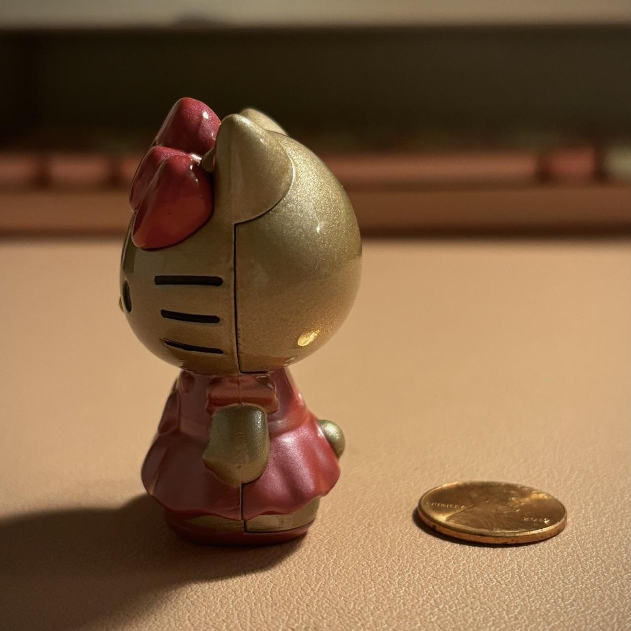 Gold hello kitty collectible figure #hellokitty... - Depop