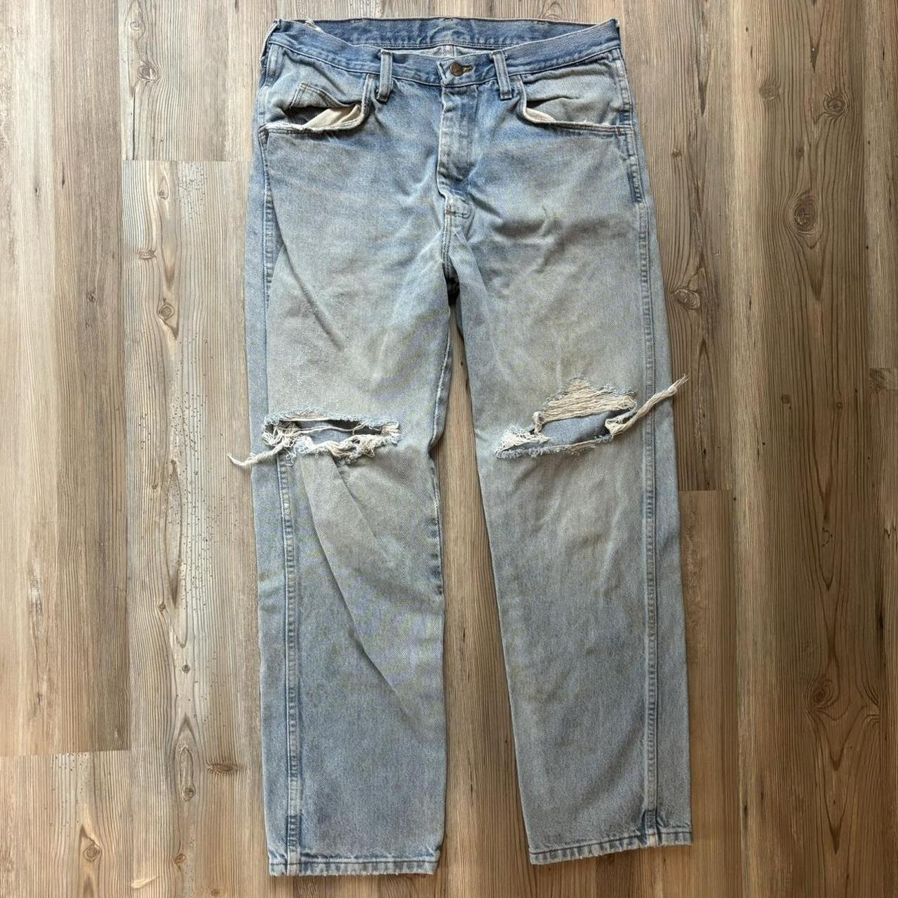 These faded and distressed Rustler jeans are... - Depop
