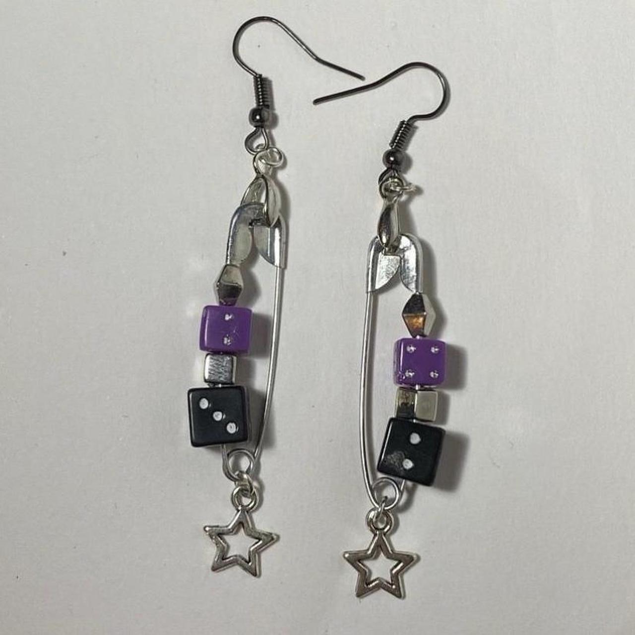 Edgy dice safety pin earrings with star charm.... - Depop