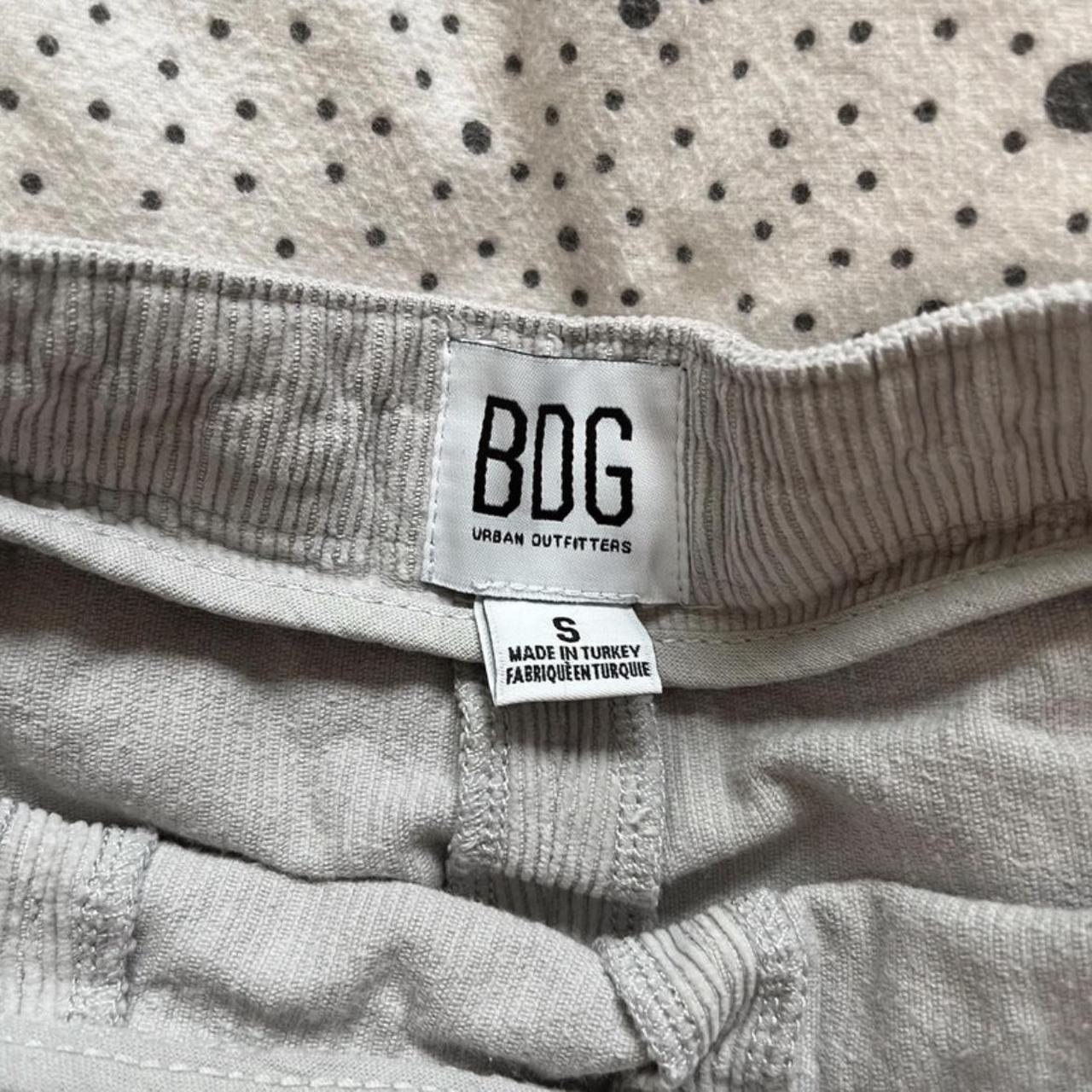 BDG Pleated Mini Skirt Light signs of use shown in... - Depop