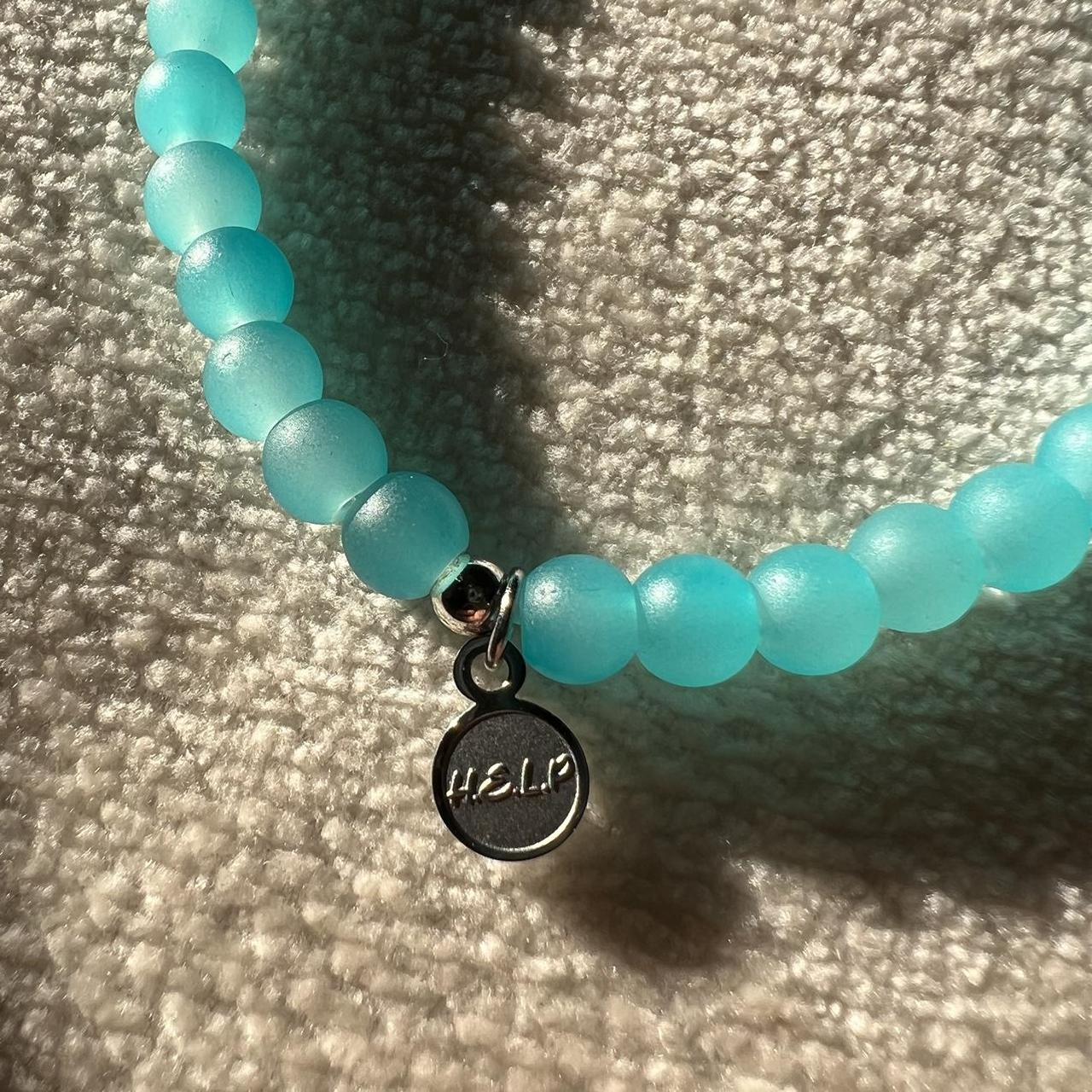 Turquoise help bracelet from paper store - Depop