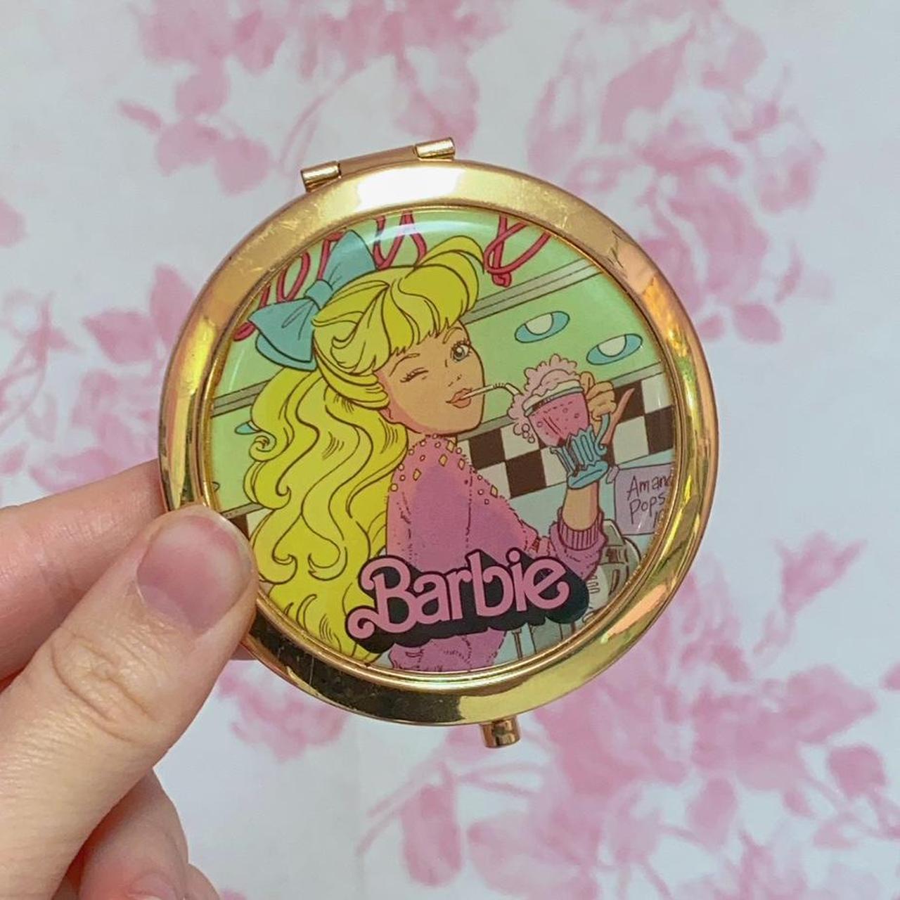 Golden barbie compact from Japan. Features a vintage... - Depop