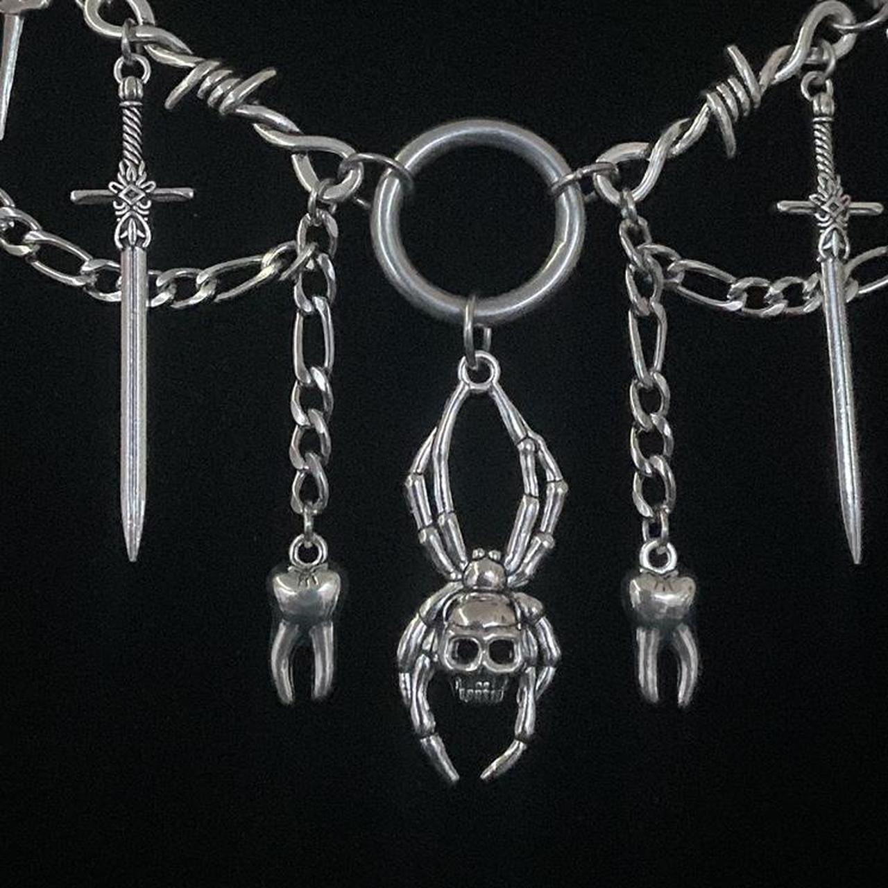 skull spider, tooth, sword, dagger, and barbed wire... - Depop