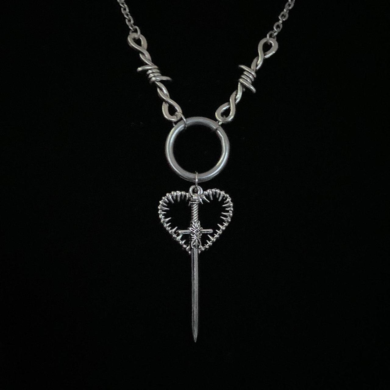 spiked heart, sword, and barbed wire o-ring... - Depop