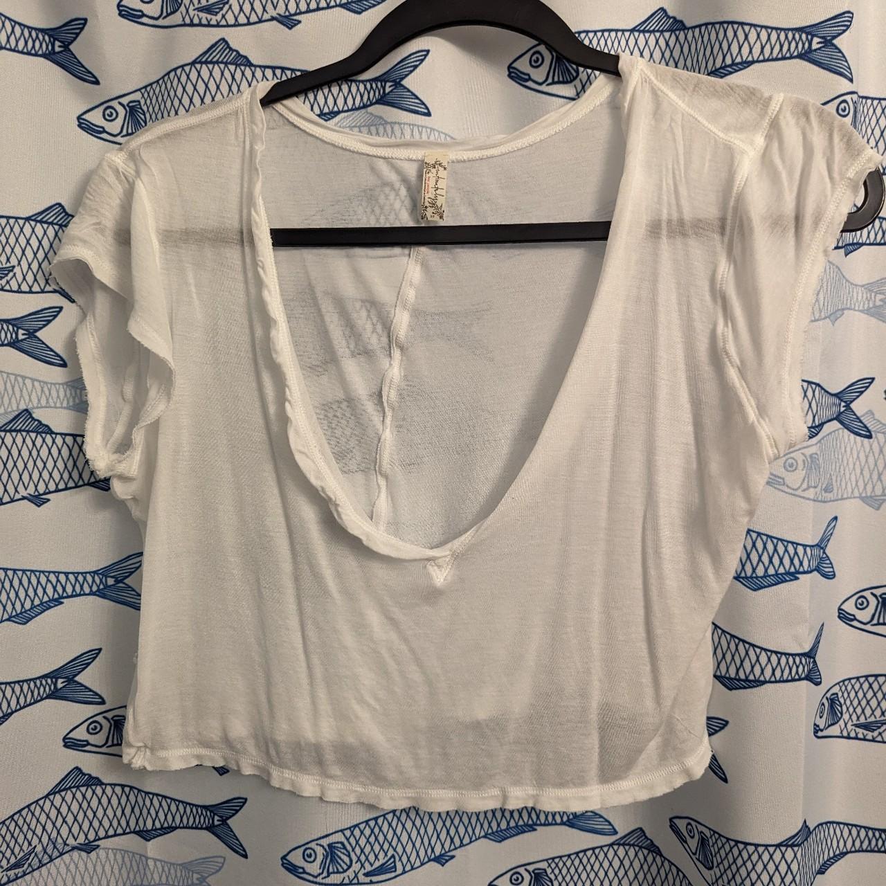 White cropped v neck free people shirt. Pretty sheer... - Depop