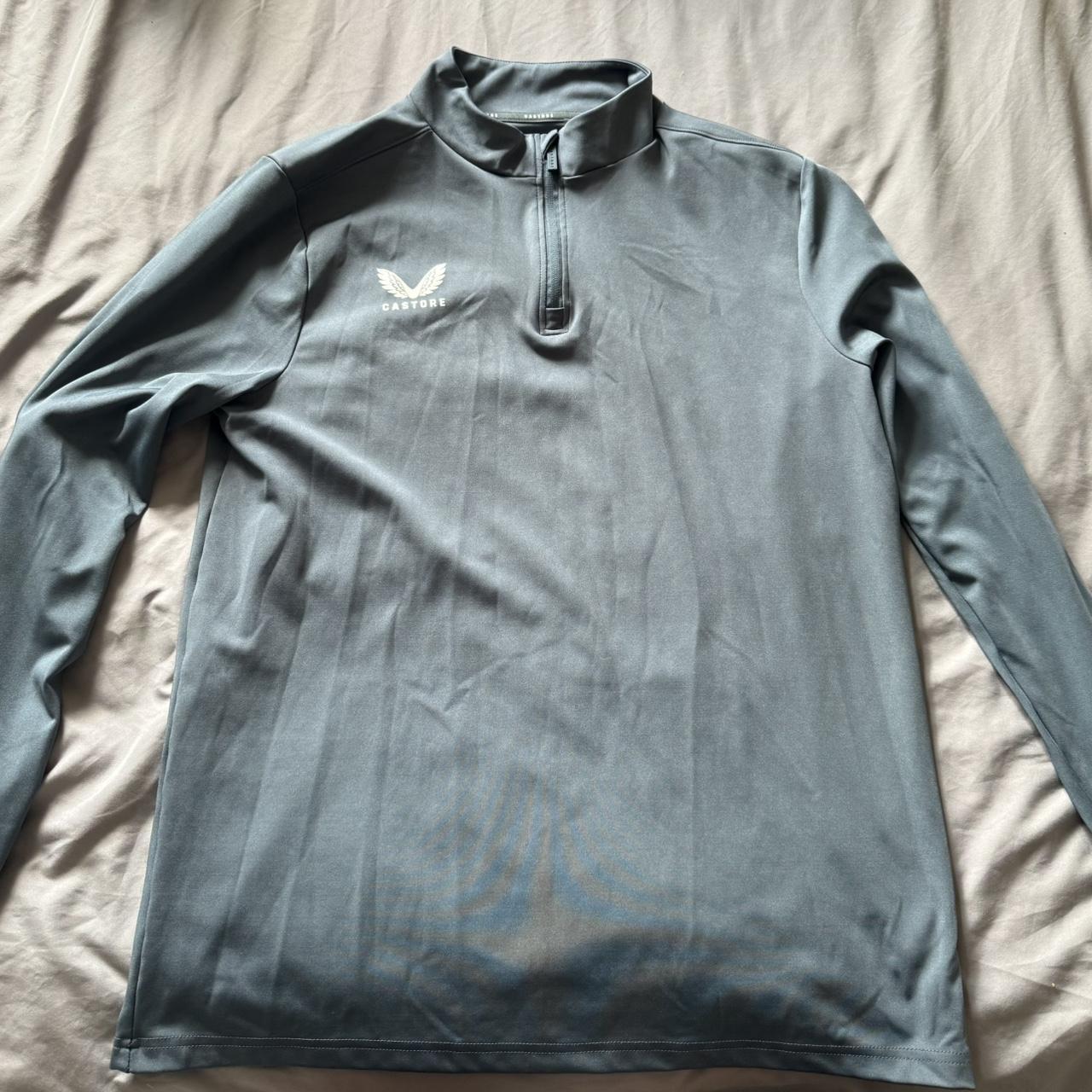 Grey/Turquoise Castore quarter zip top Size M... | Depop