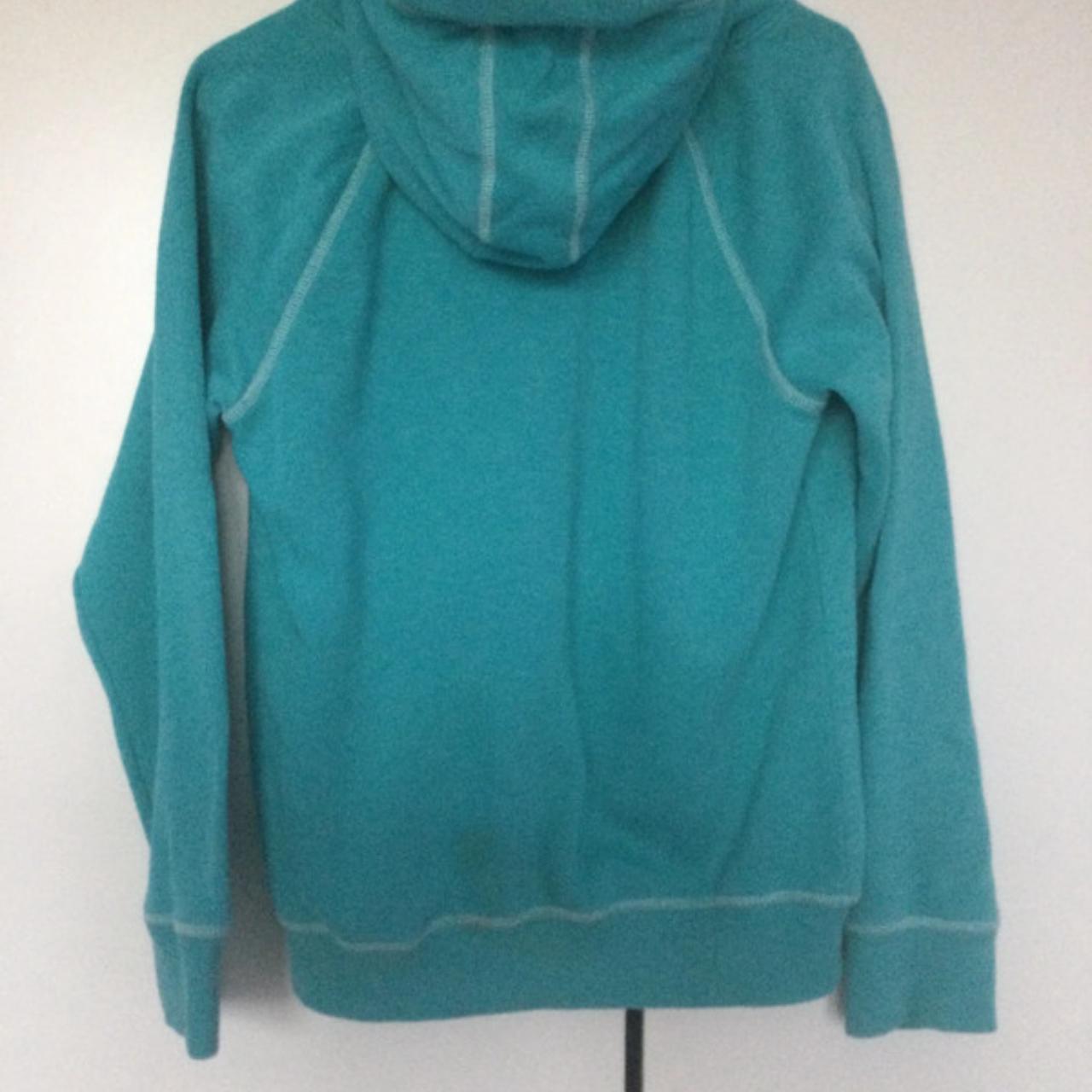 Teal / Turquoise / Cyan Next Hoodie With white text... - Depop