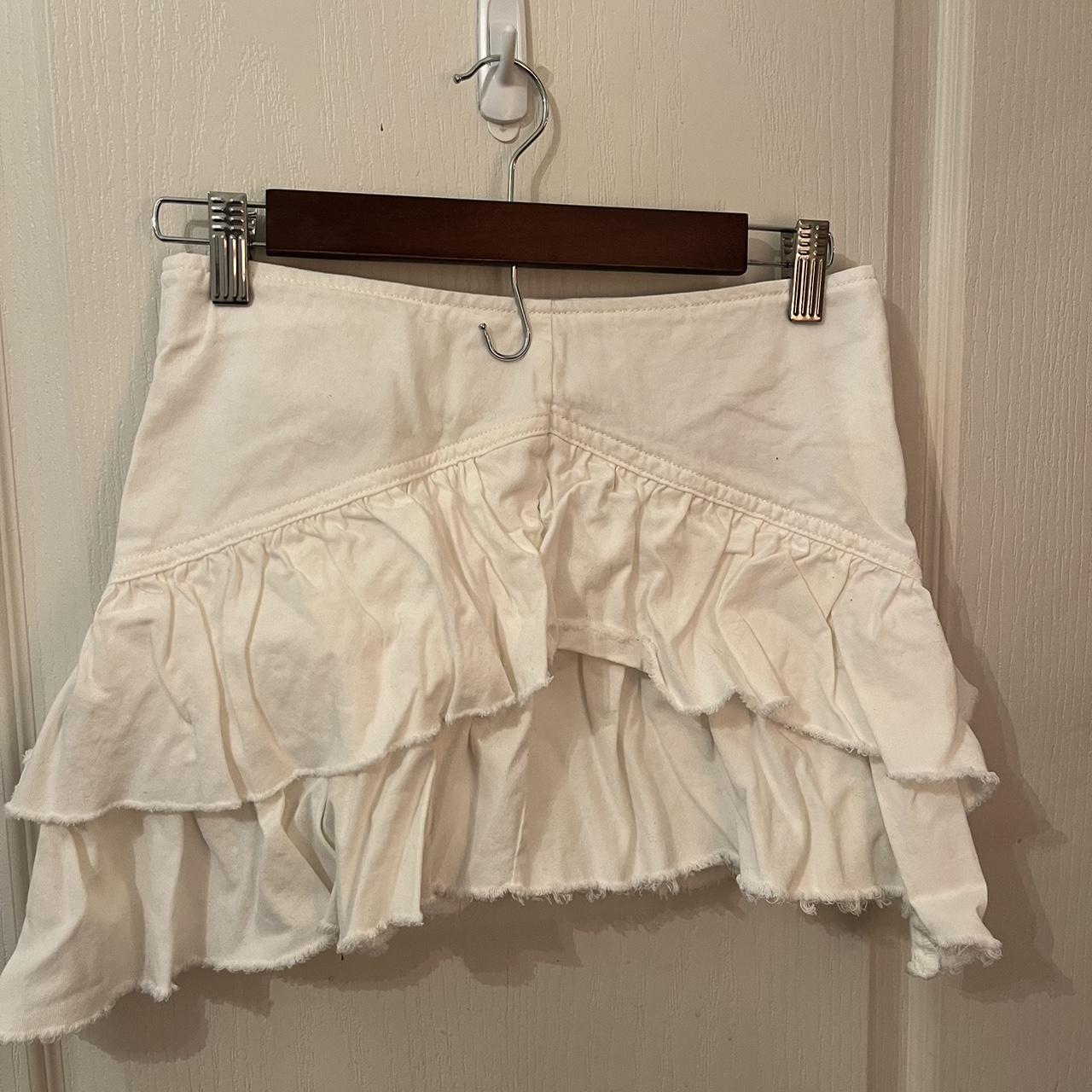 White ruffle skirt with a small tear on the front... - Depop