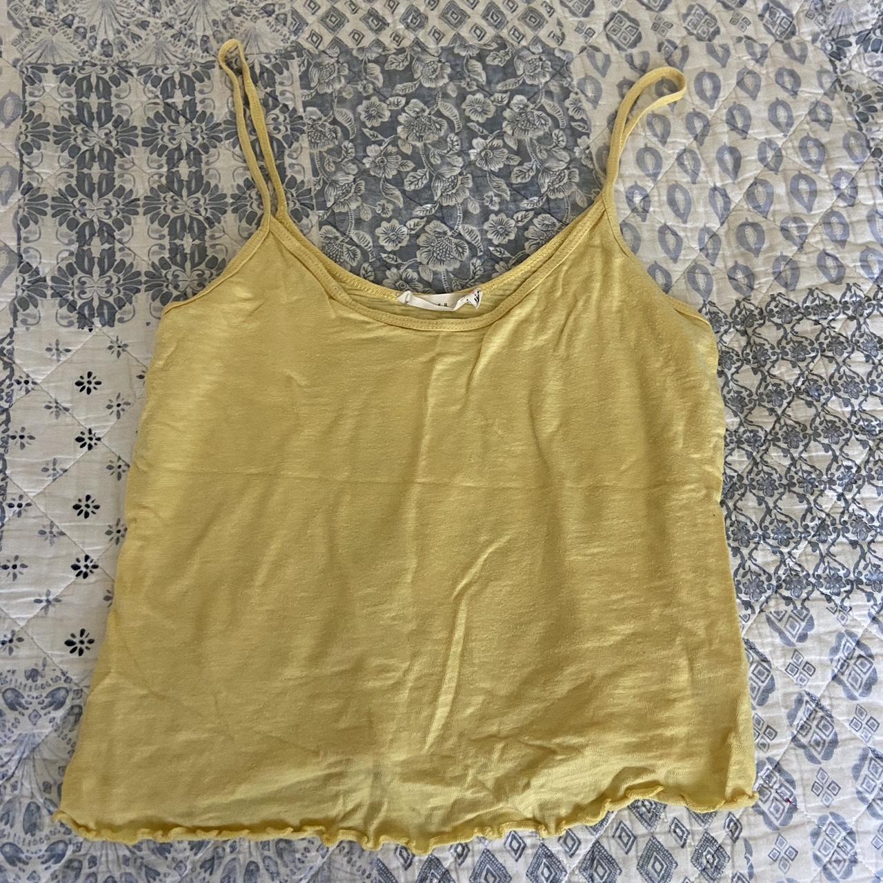 Woman’s yellow tank with ruffle ends! Size xs loose fit - Depop