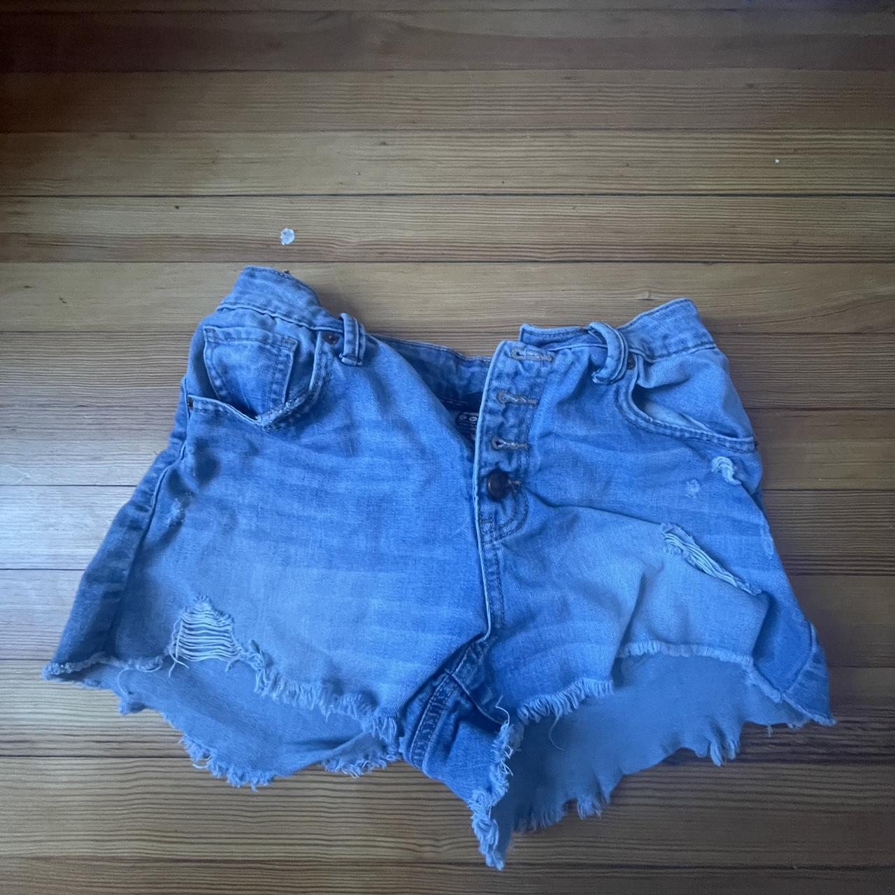 Blue denim shorts with a button fly low rise - Depop