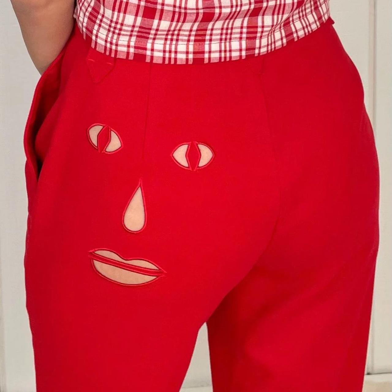 Fashion Brand Company Red Face Cutout Pants Some... - Depop