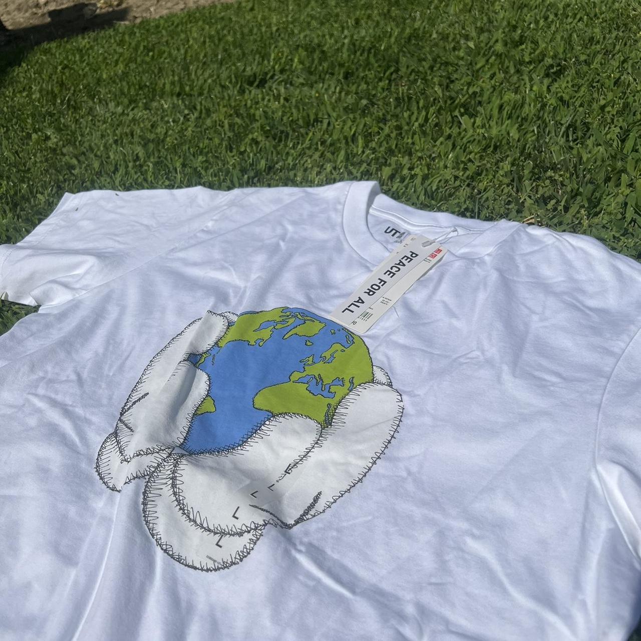 KAWS x UNIQLO PEACE FOR ALL TEE - SIZE LARGE -... - Depop