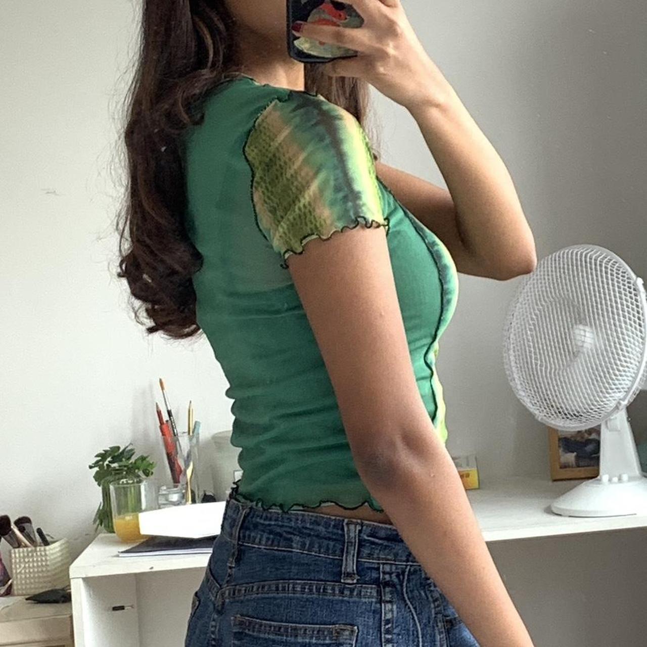 Green mesh top with lettuce hem detailing. Size:... - Depop