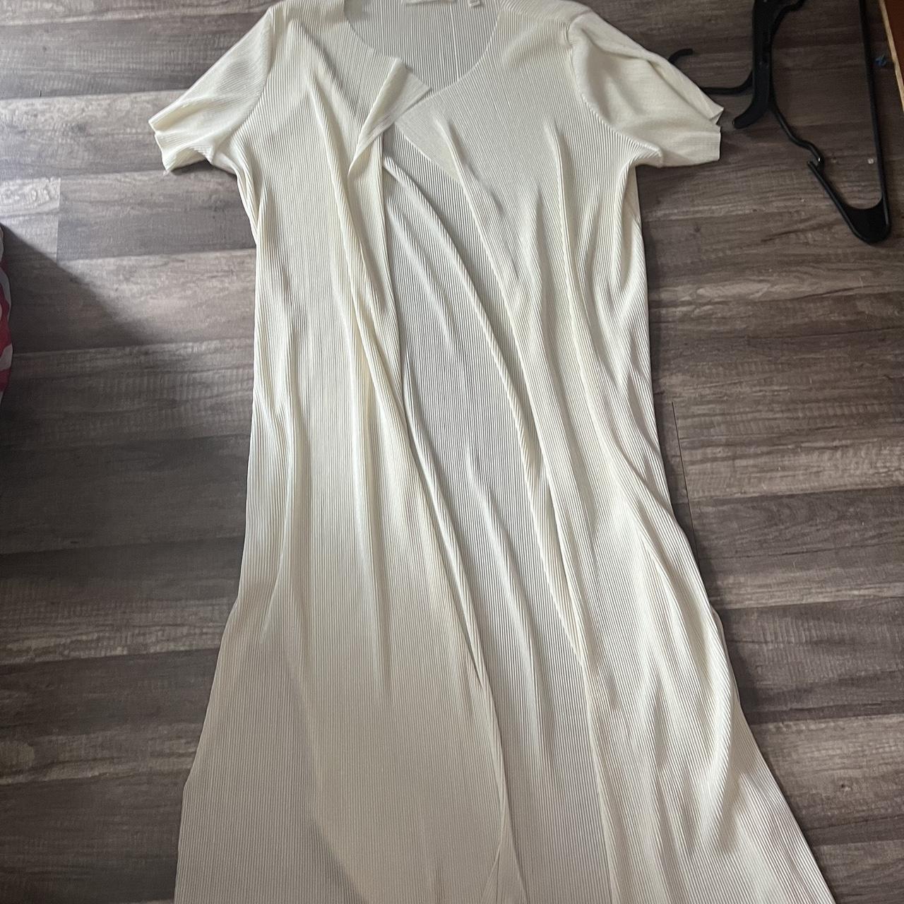 Long cream colored Cyrus short sleeve cardigan. This... - Depop