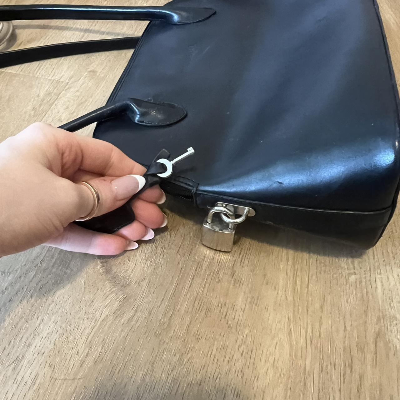 Small black handbag with lock and key - Depop