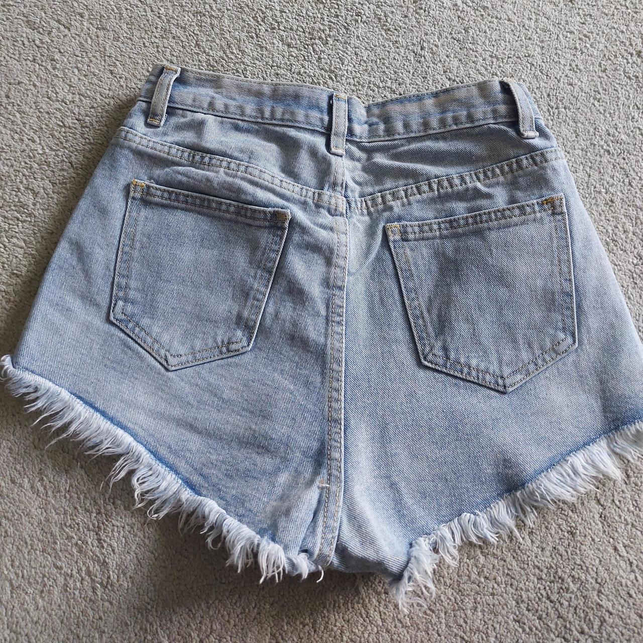 Denim shorts with frayed hem from... - Depop
