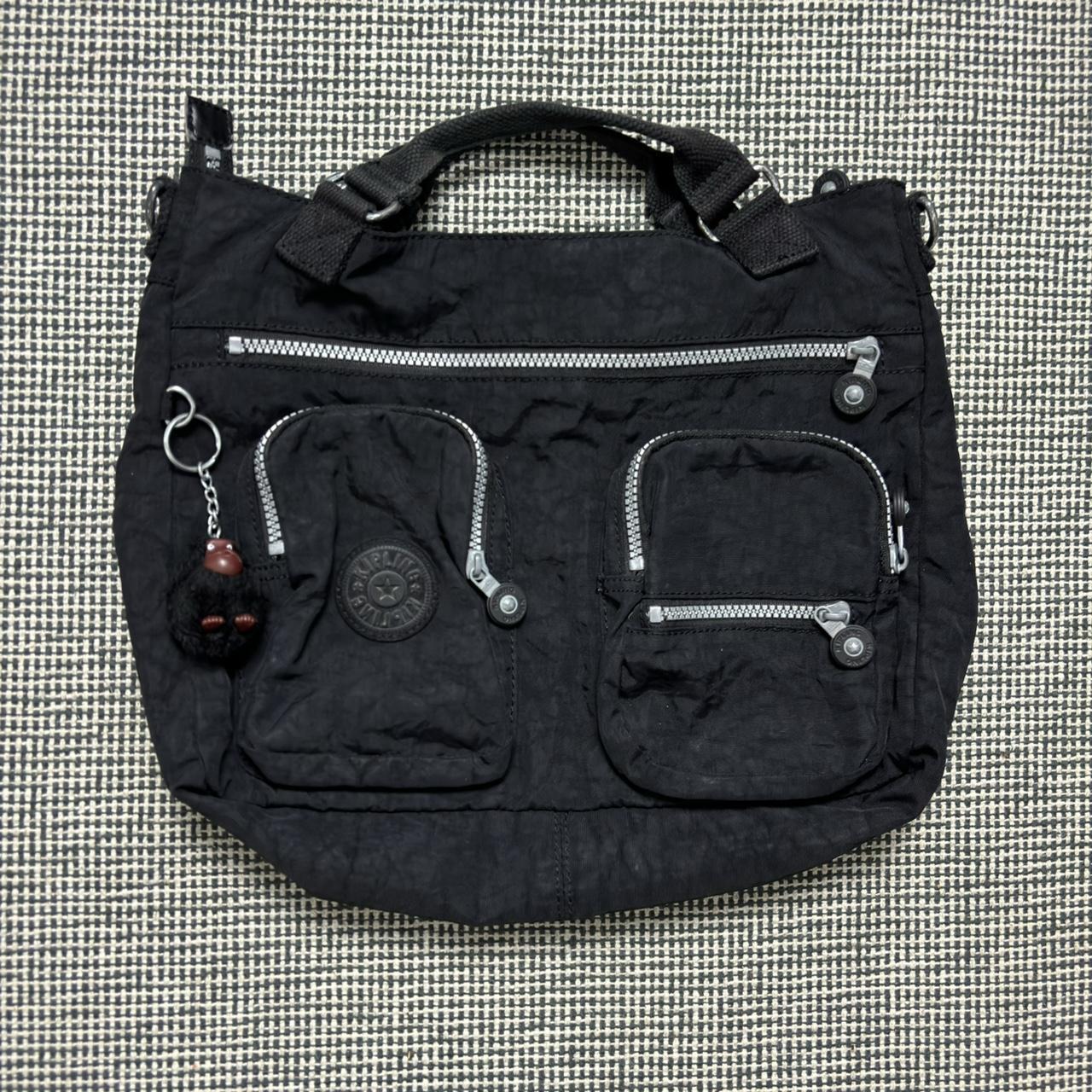 Black kipling hand bag. Featuring multiple zipper... - Depop