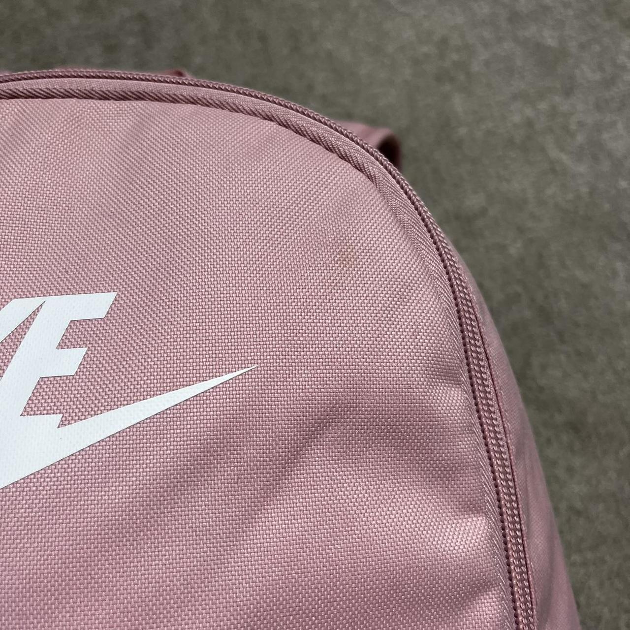 pink nike backpack great condition apart from two... - Depop