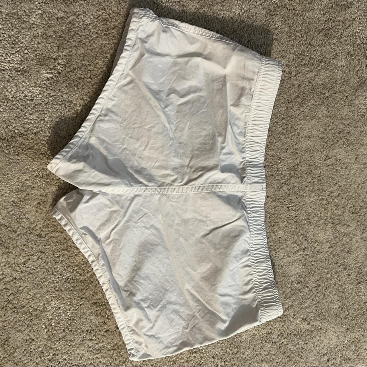 white lacoste shorts labeled size 4, recommend for... - Depop