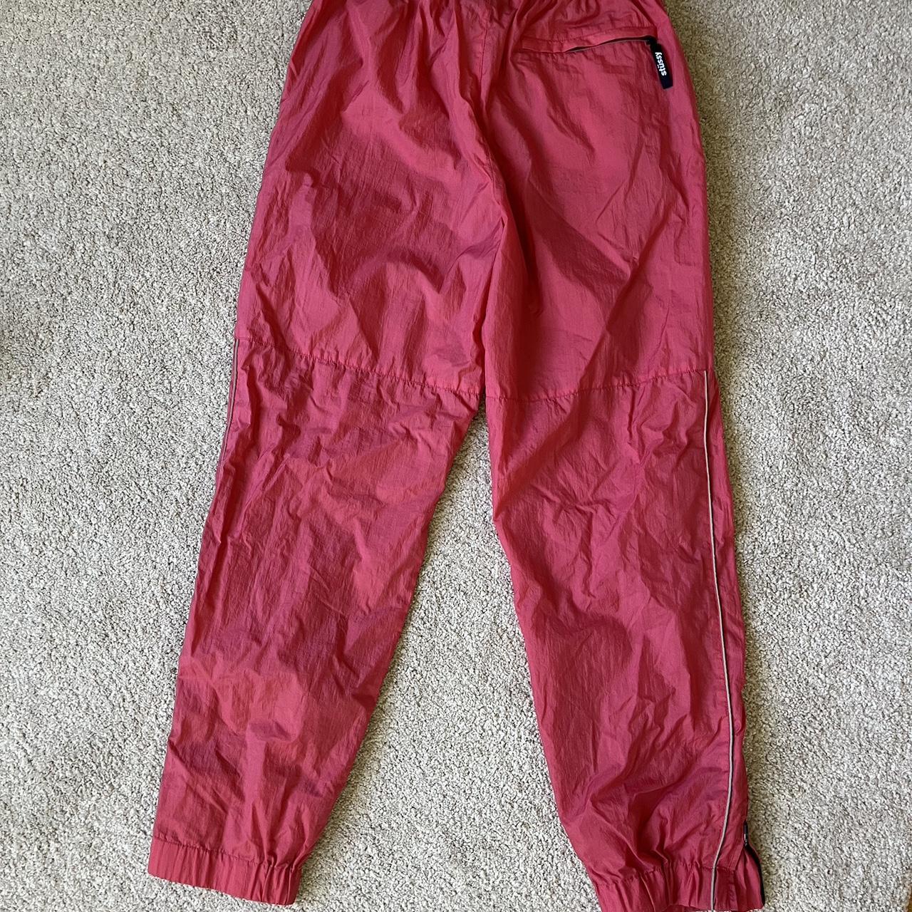 Pink stussy windbreak pants/ track pants Worn a... - Depop