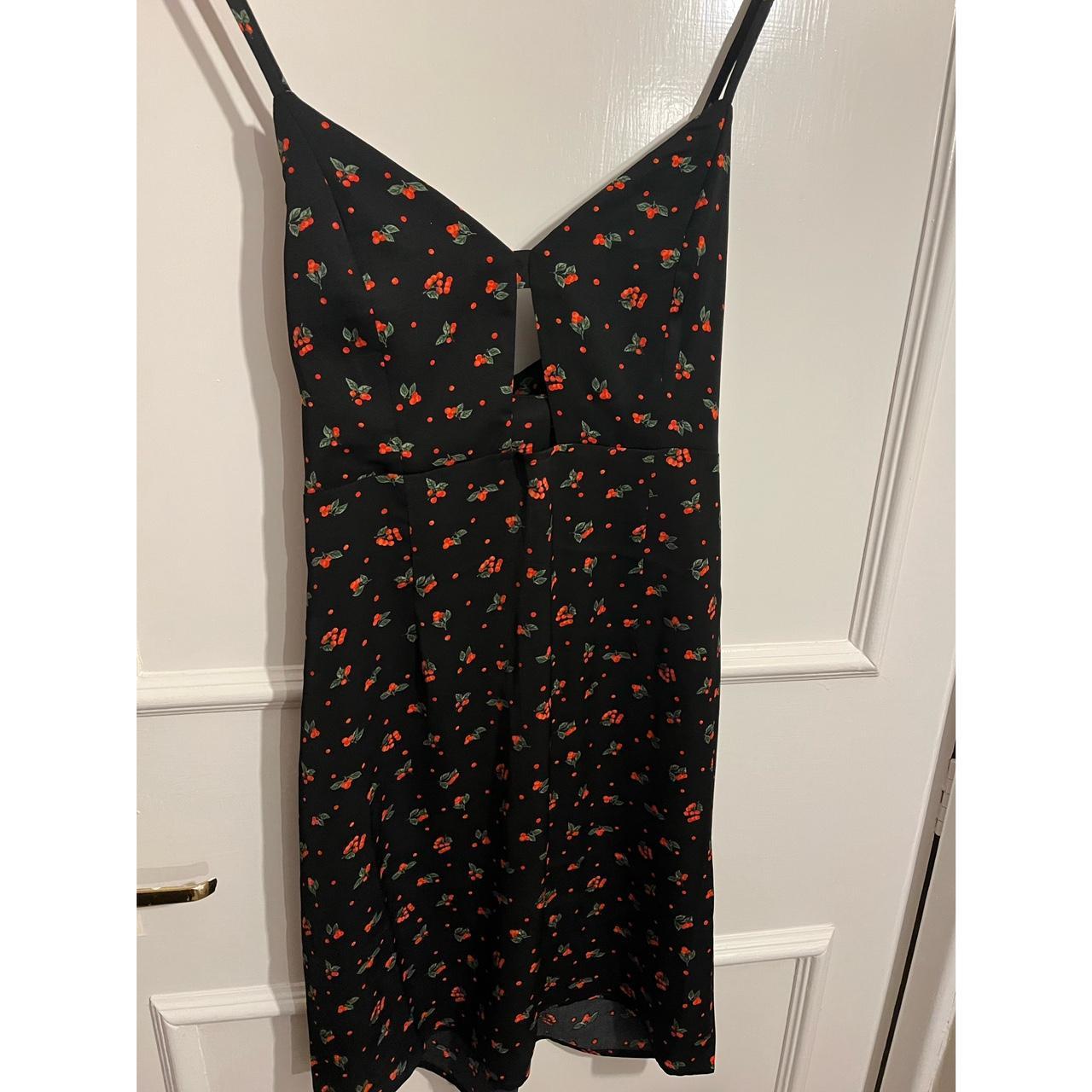 Black cherry print mini dress with cut out never... - Depop