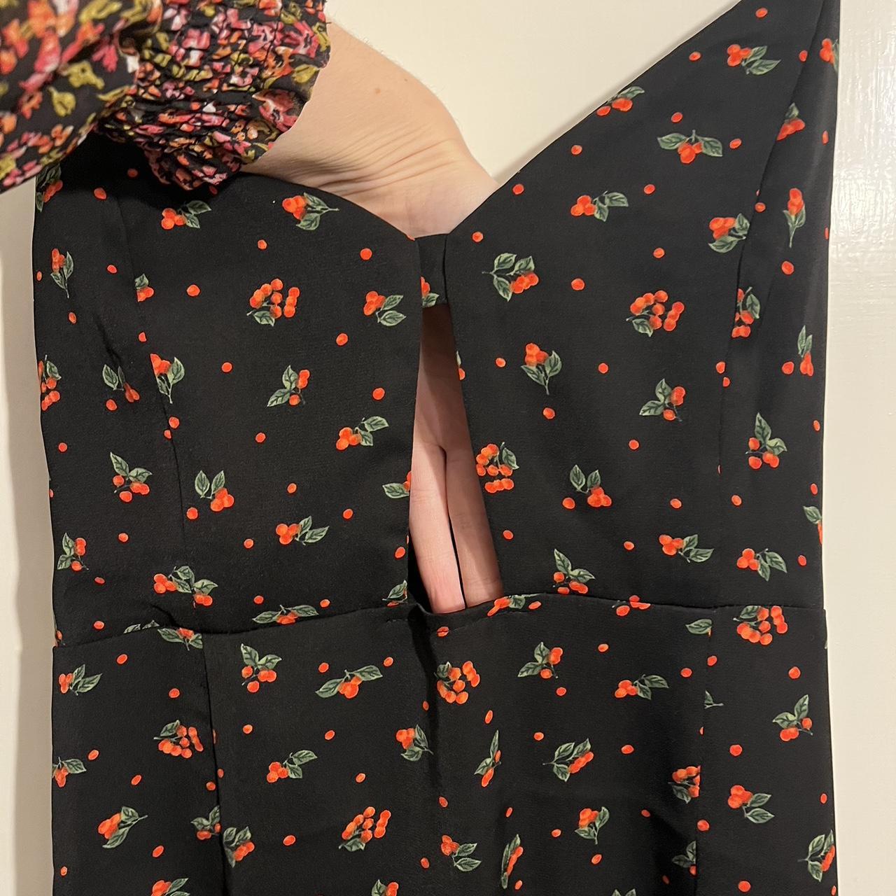 Black cherry print mini dress with cut out never... - Depop