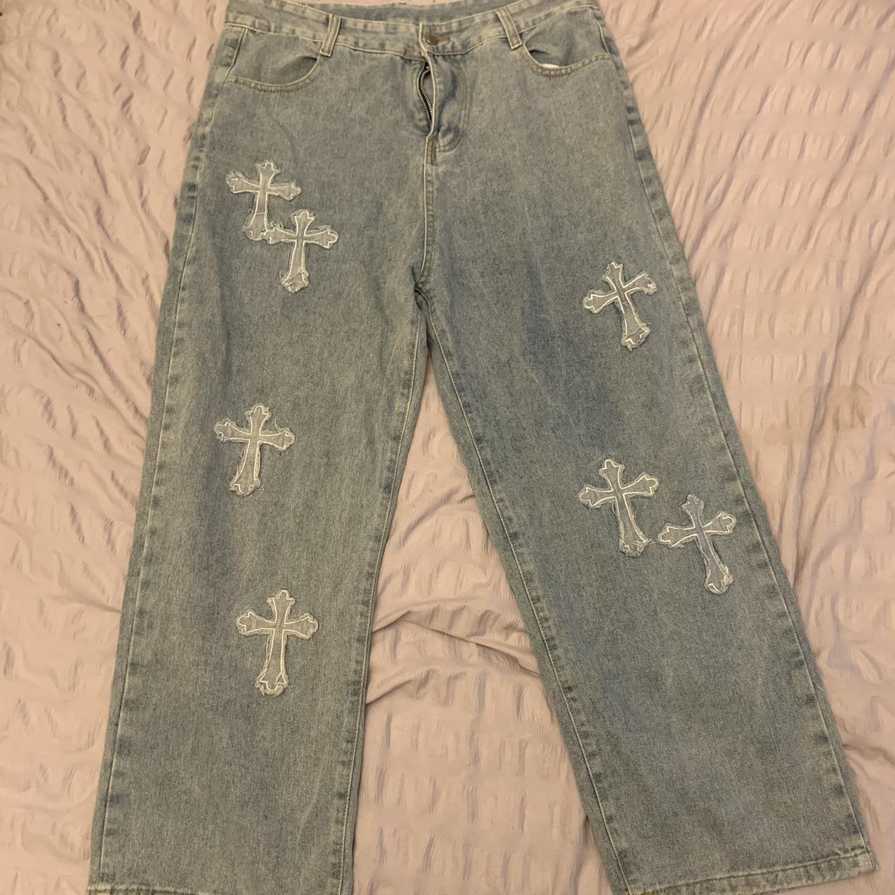 Blue denim jeans with crosses embroidered into... - Depop