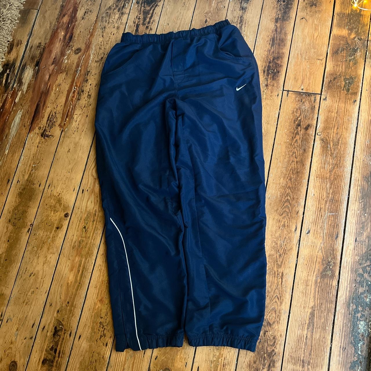 Super sick vintage baggy nike shell joggers in blue... - Depop