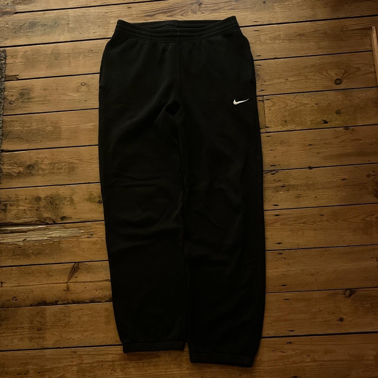 Super sick baggy Nike fleeced joggers in black with... - Depop