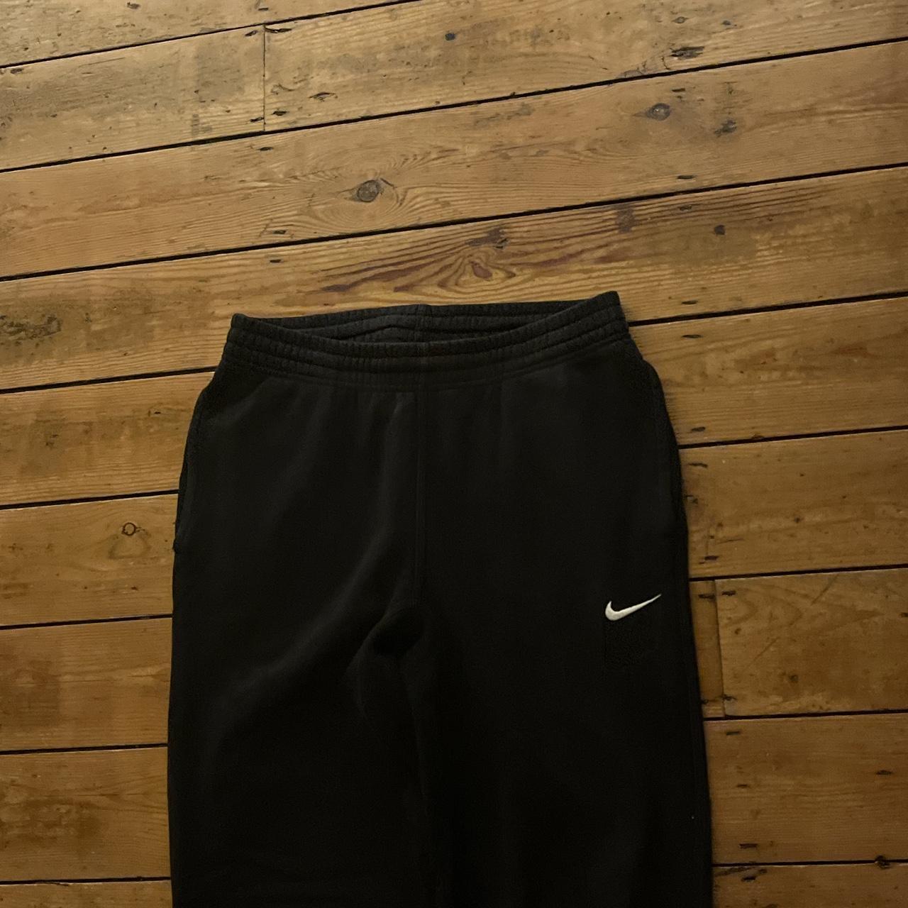 Super sick baggy Nike fleeced joggers in black with... - Depop
