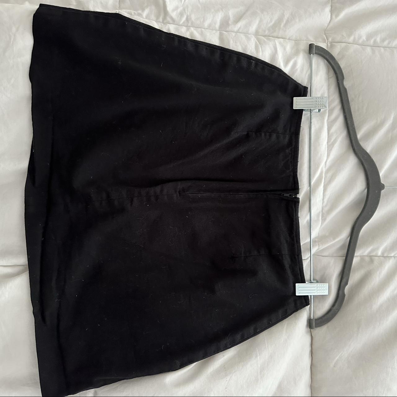 Vintage basic black mini skirt with small slit on... - Depop