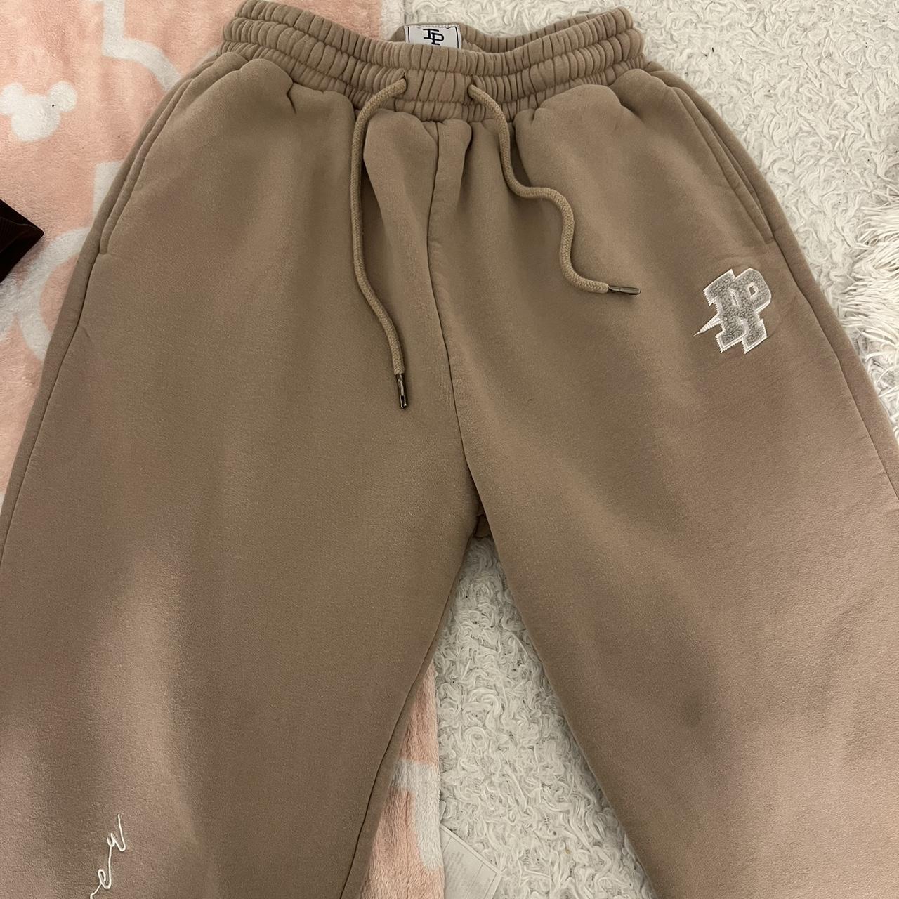 inaka power cream sweat pants with embroidery on the... - Depop