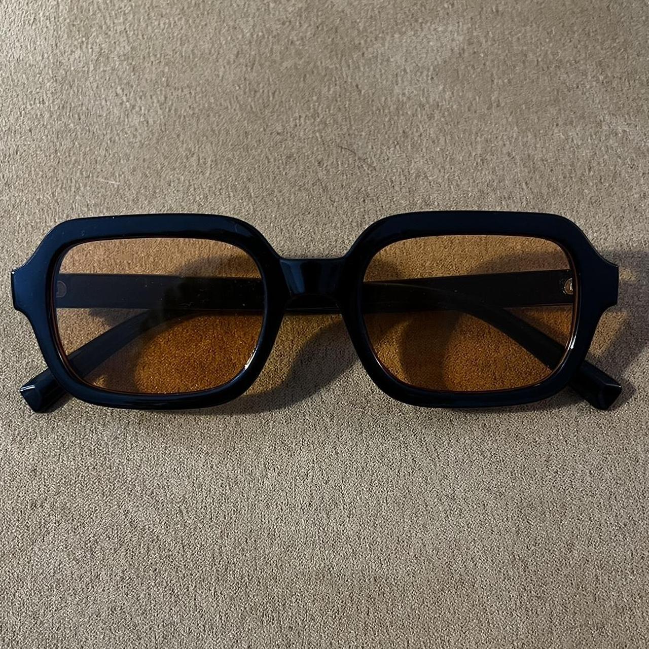 Retro black sunnies with orange/peachy lenses. So fun! - Depop
