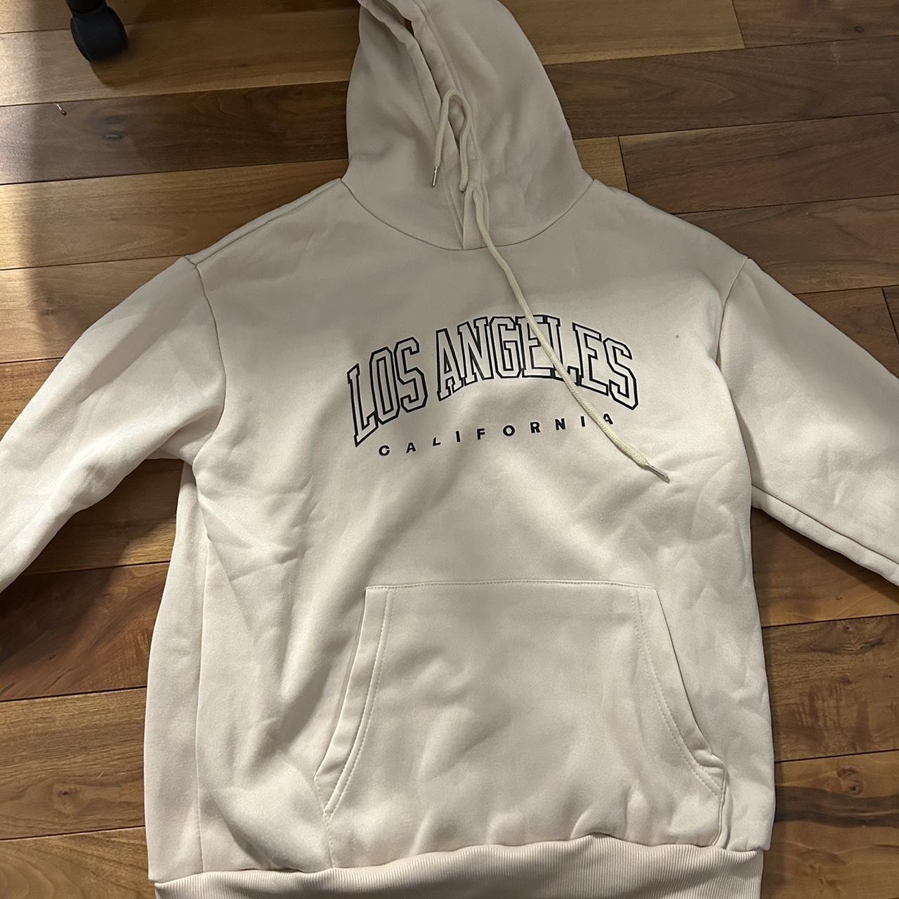 Beige los angeles hoodie. M Never worn. will take a... - Depop