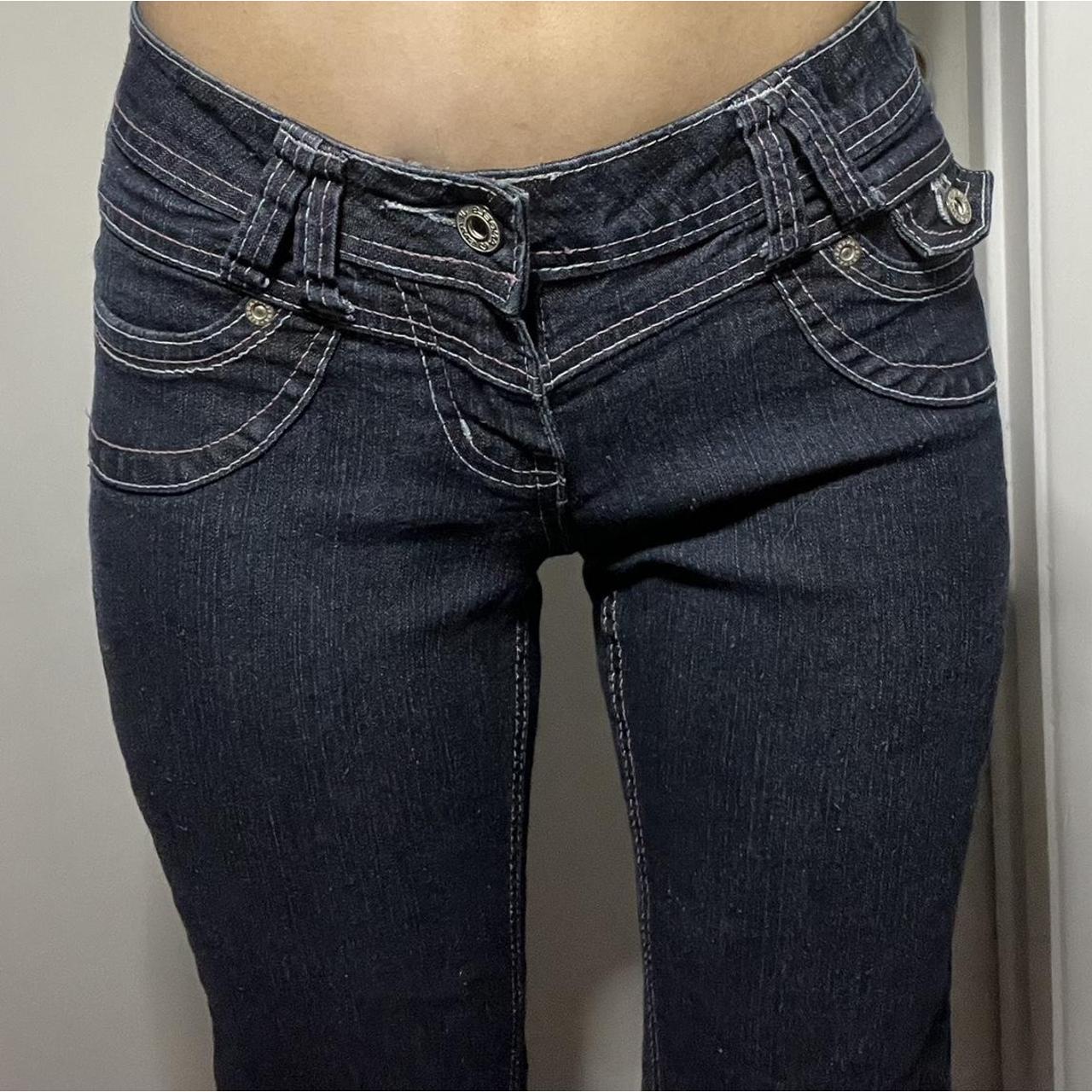 flared angel jeans with pink and white stitching... - Depop