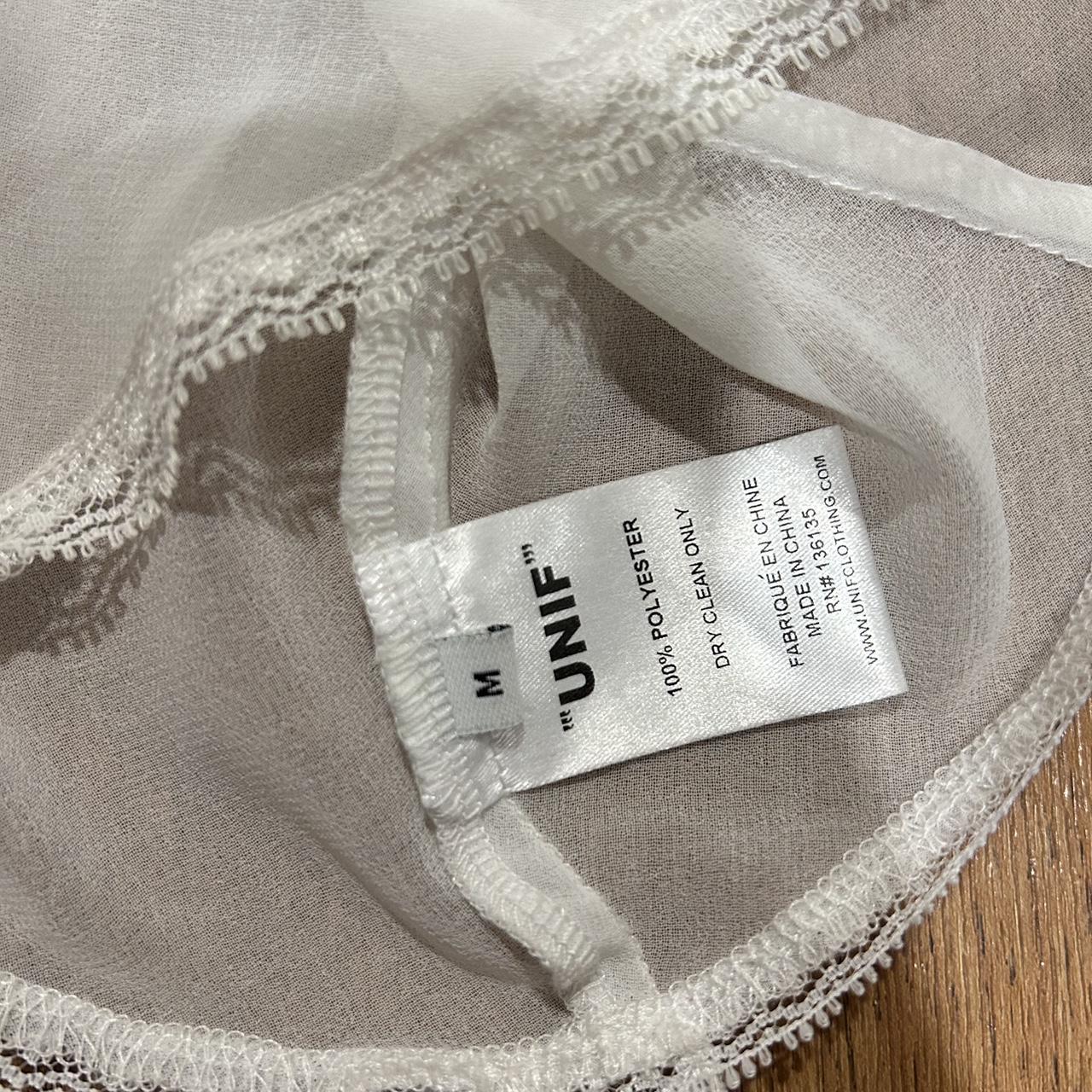 white unif angel top size medium worn once slight... - Depop