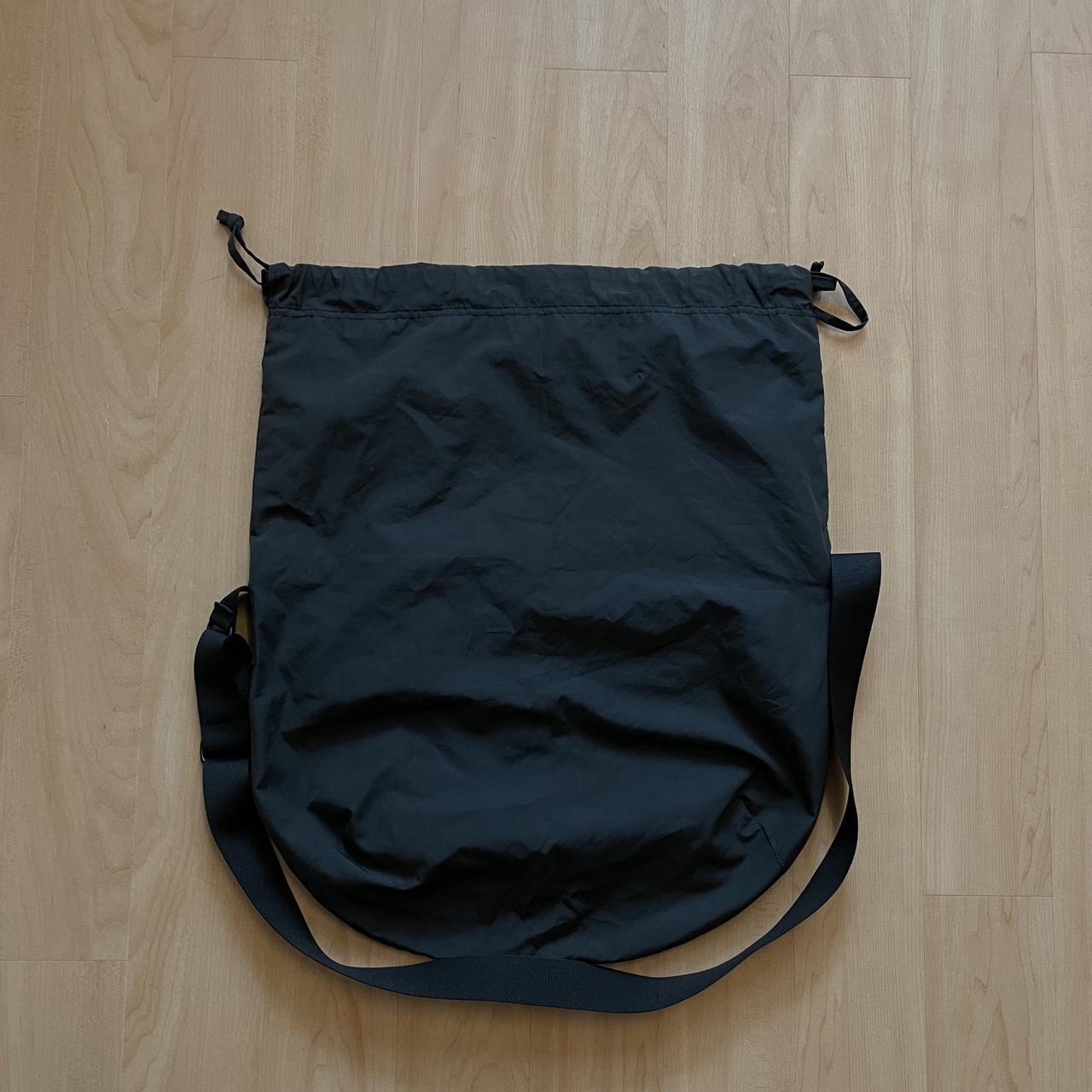 Uniqlo Drawstring Bag Black worn a few times,... - Depop